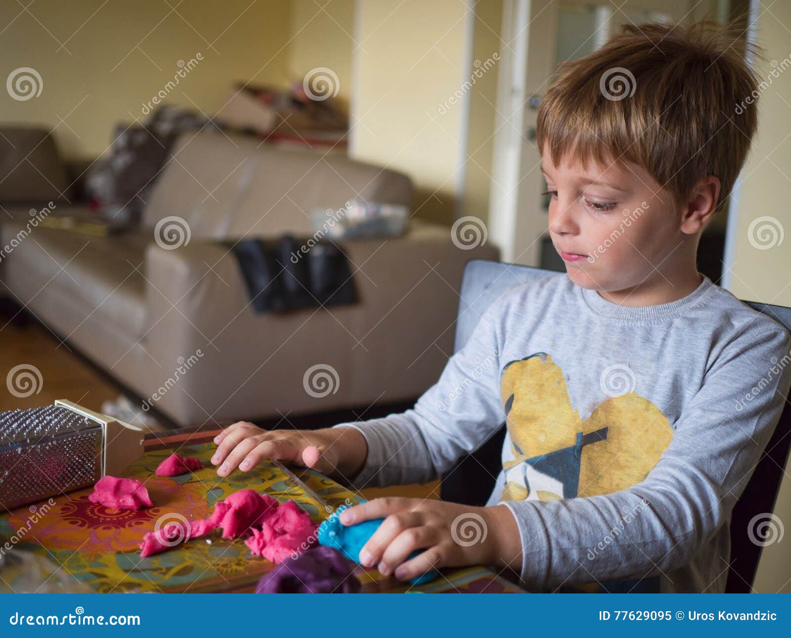 Playing with plasticine stock image. Image of plasticine - 77629095