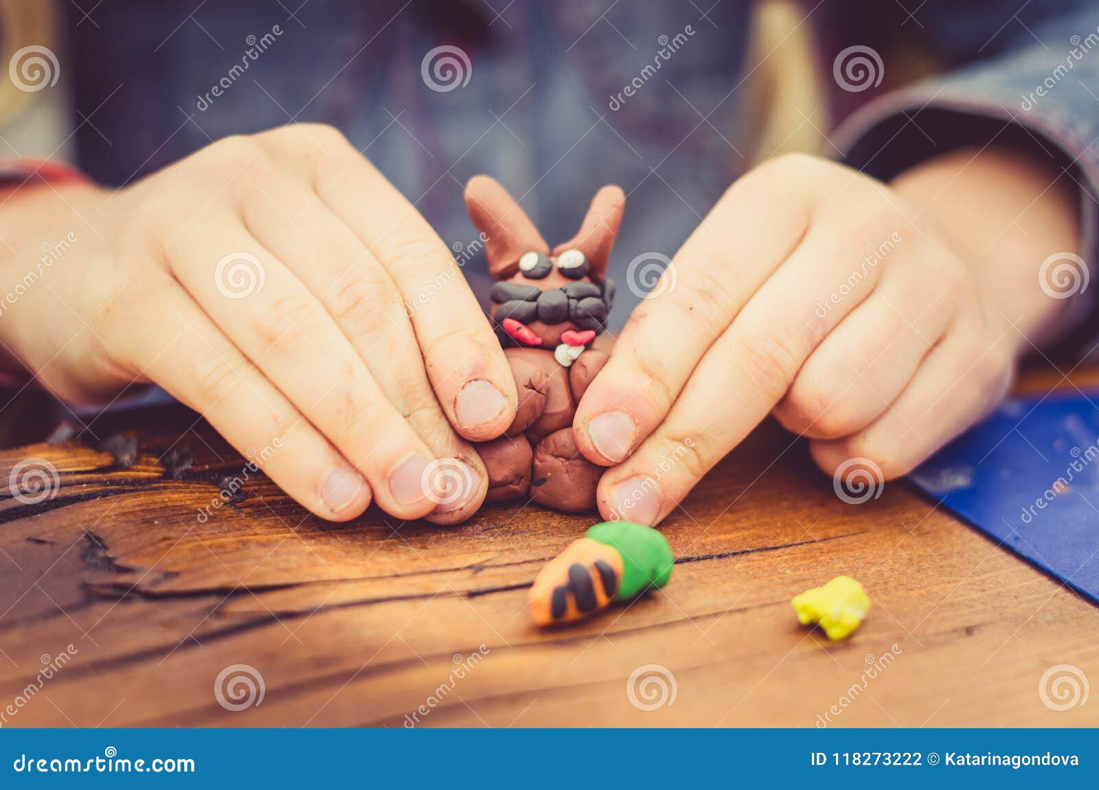 Playing with play dough stock photo. Image of hands - 118273222