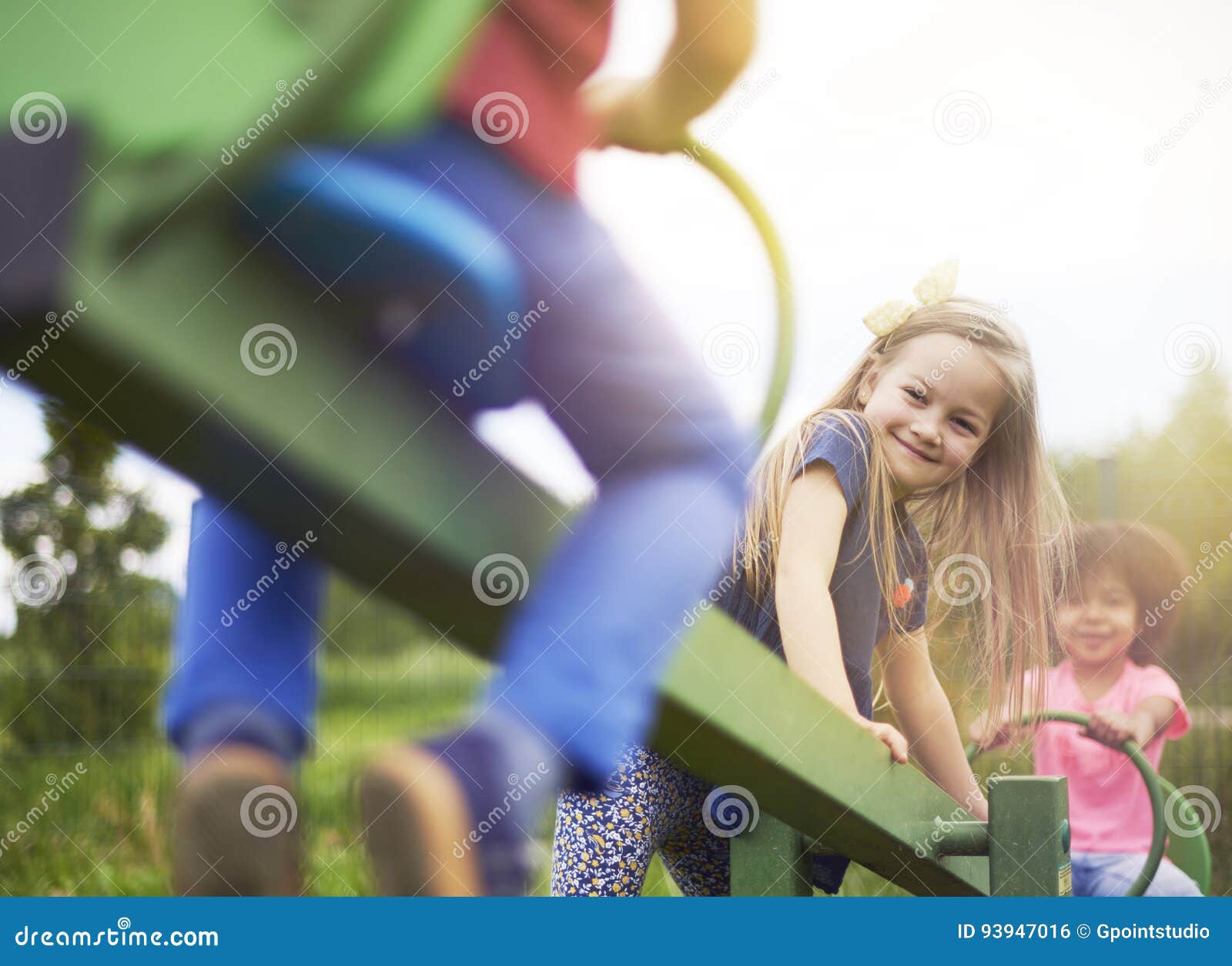 Playing on the playground stock photo. Image of park - 93947016