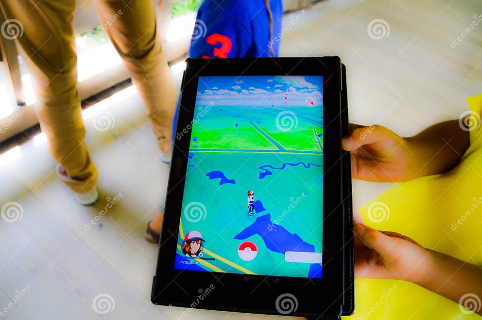Playing Pokemon Go editorial photo. Image of hand, japan - 96528431