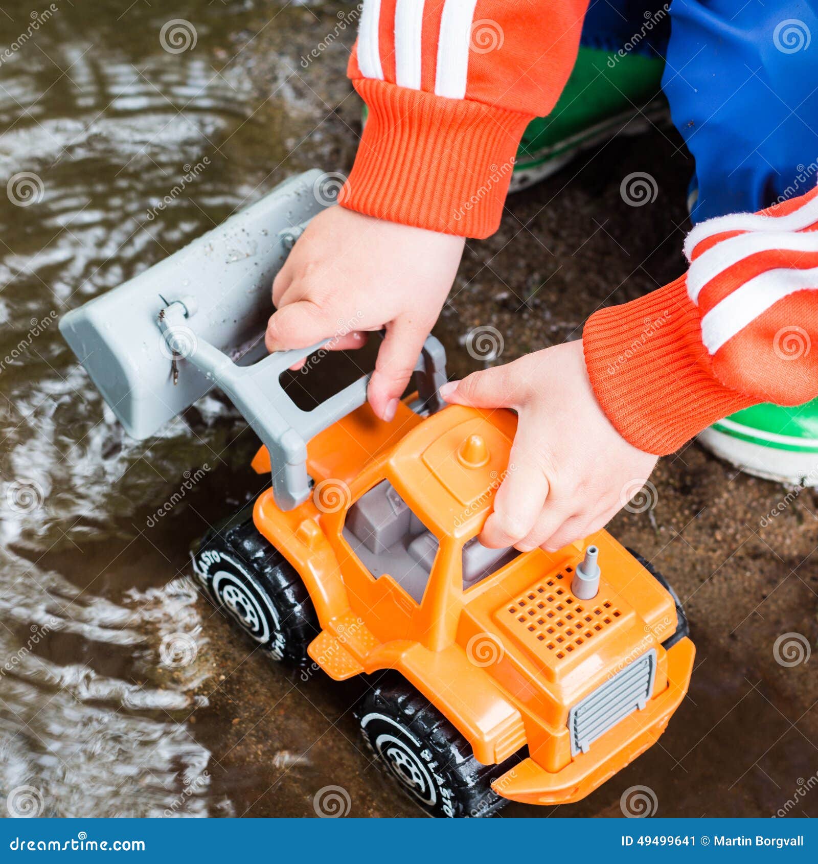 Playing in the puddle stock image. Image of blue, plaing - 49499641