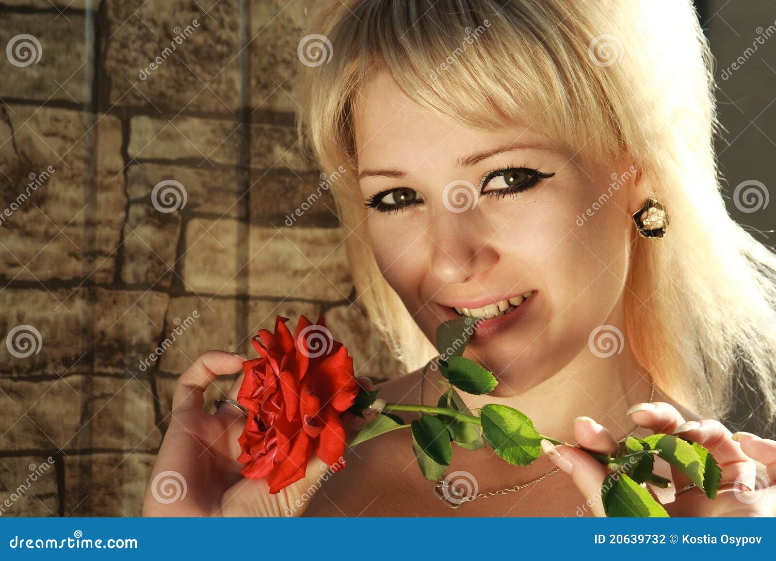 Playing with a red rose stock photo. Image of looking - 20639732