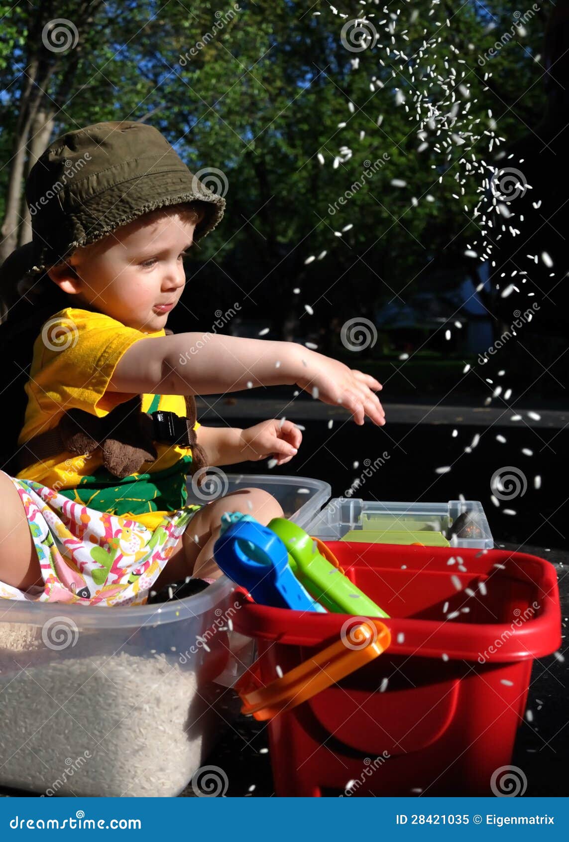 Playing with Rice stock image. Image of adorable, caucasian - 28421035