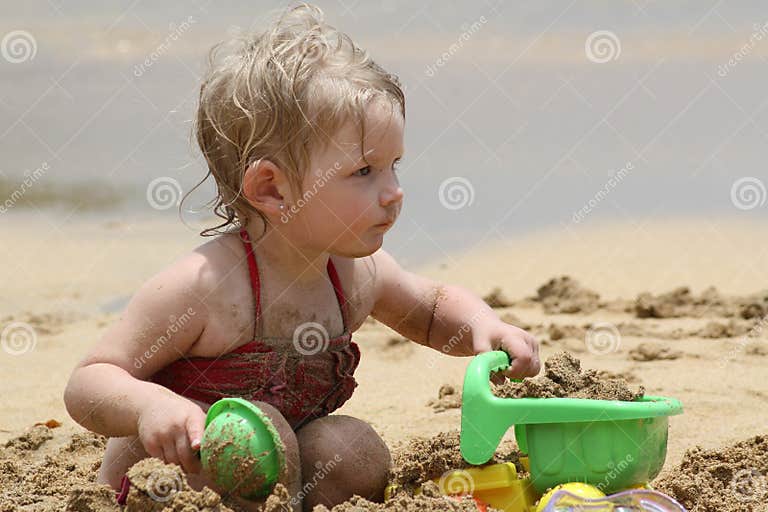 Playing in the sand stock image. Image of enjoy, child - 8309213