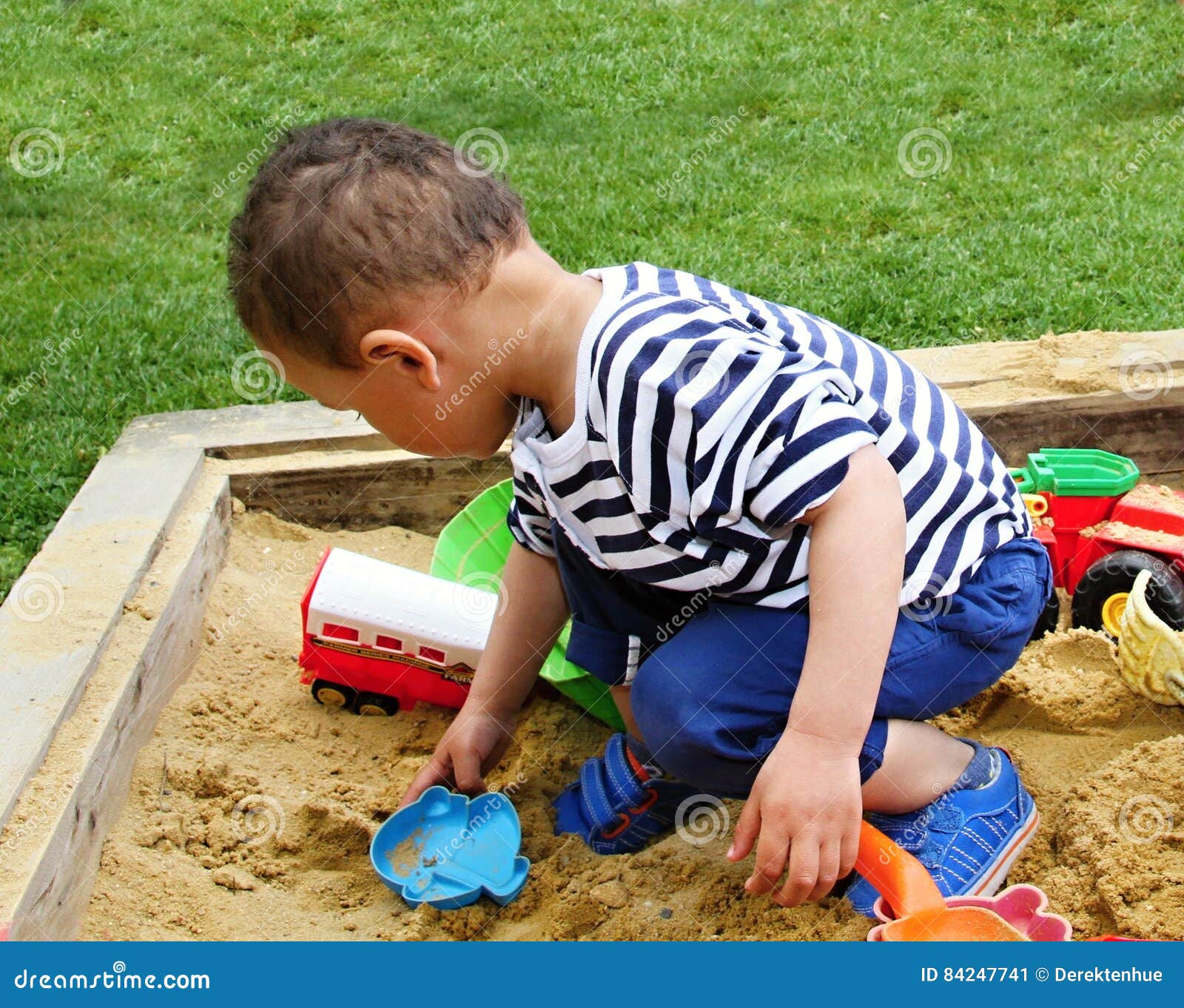 Playing in sand pit stock image. Image of handle, little - 84247741