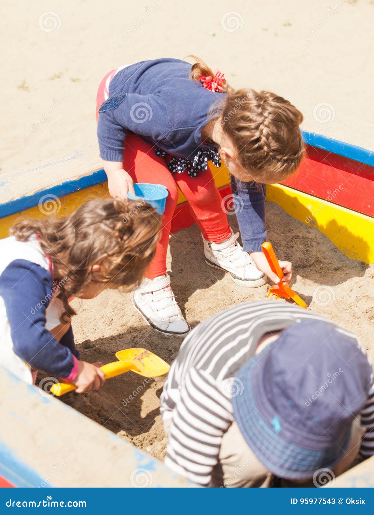 Playing in the sandbox stock image. Image of parenthood - 95977543