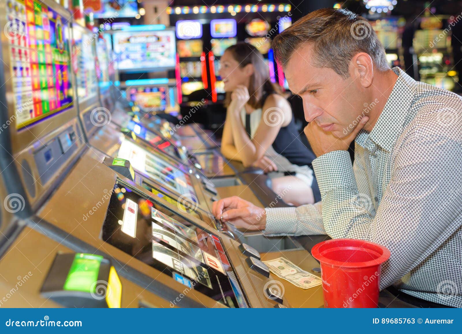Playing on slot machines stock image. Image of playing - 89685763