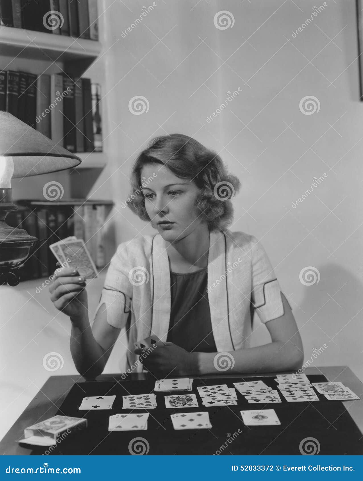 Playing solitaire stock photo. Image of concentrate, 19301939 - 52033372