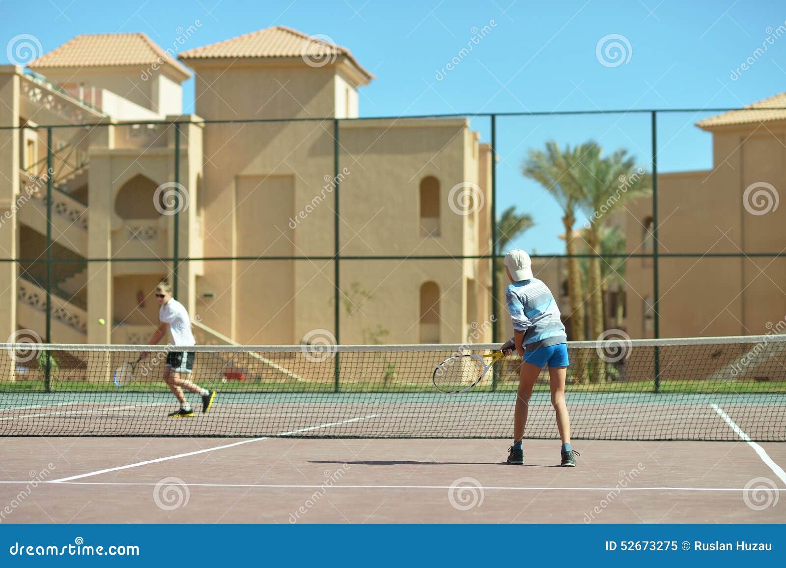 Playing at tennis court stock image. Image of looking - 52673275
