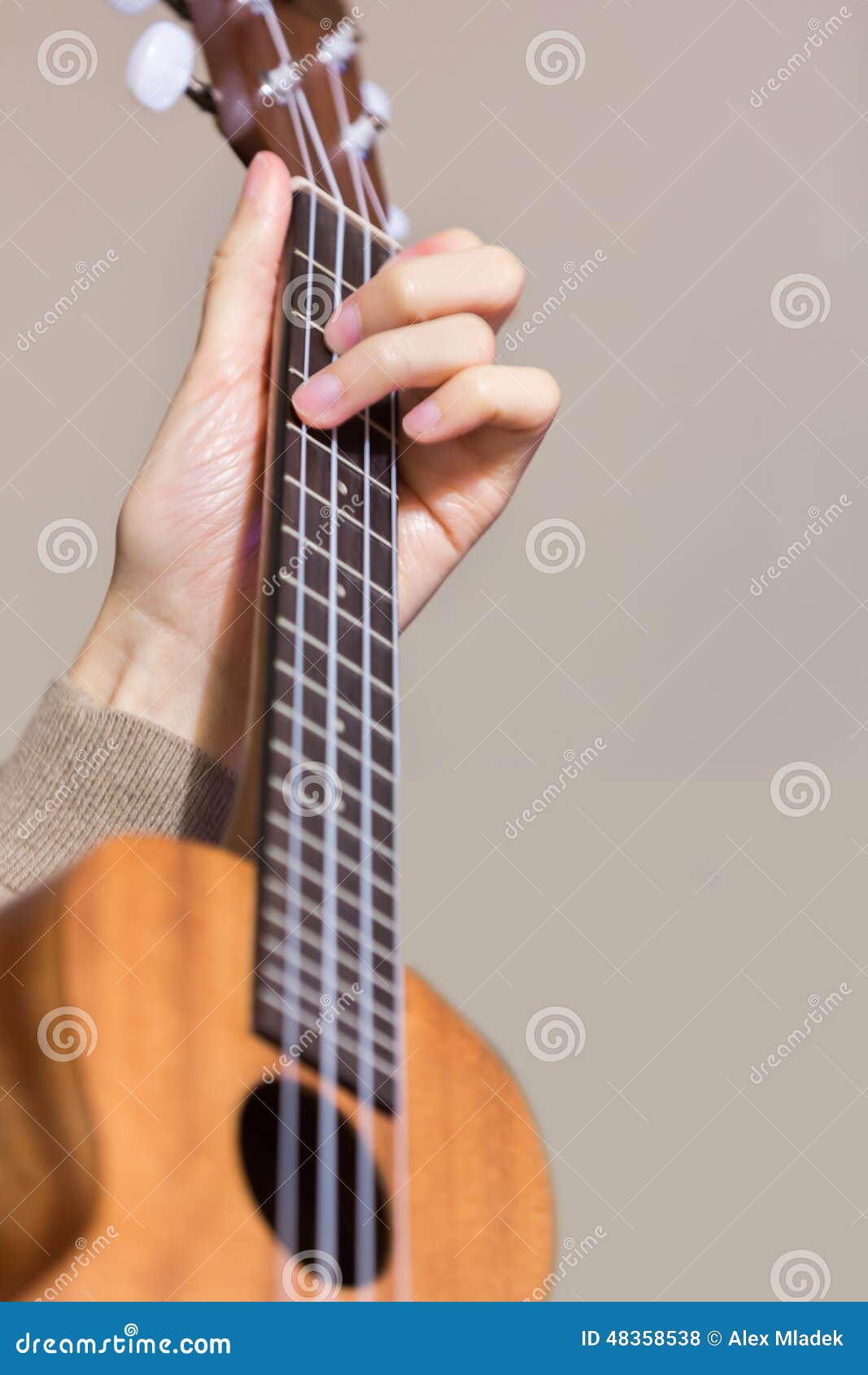 Playing a ukelele stock photo. Image of background, fret - 48358538