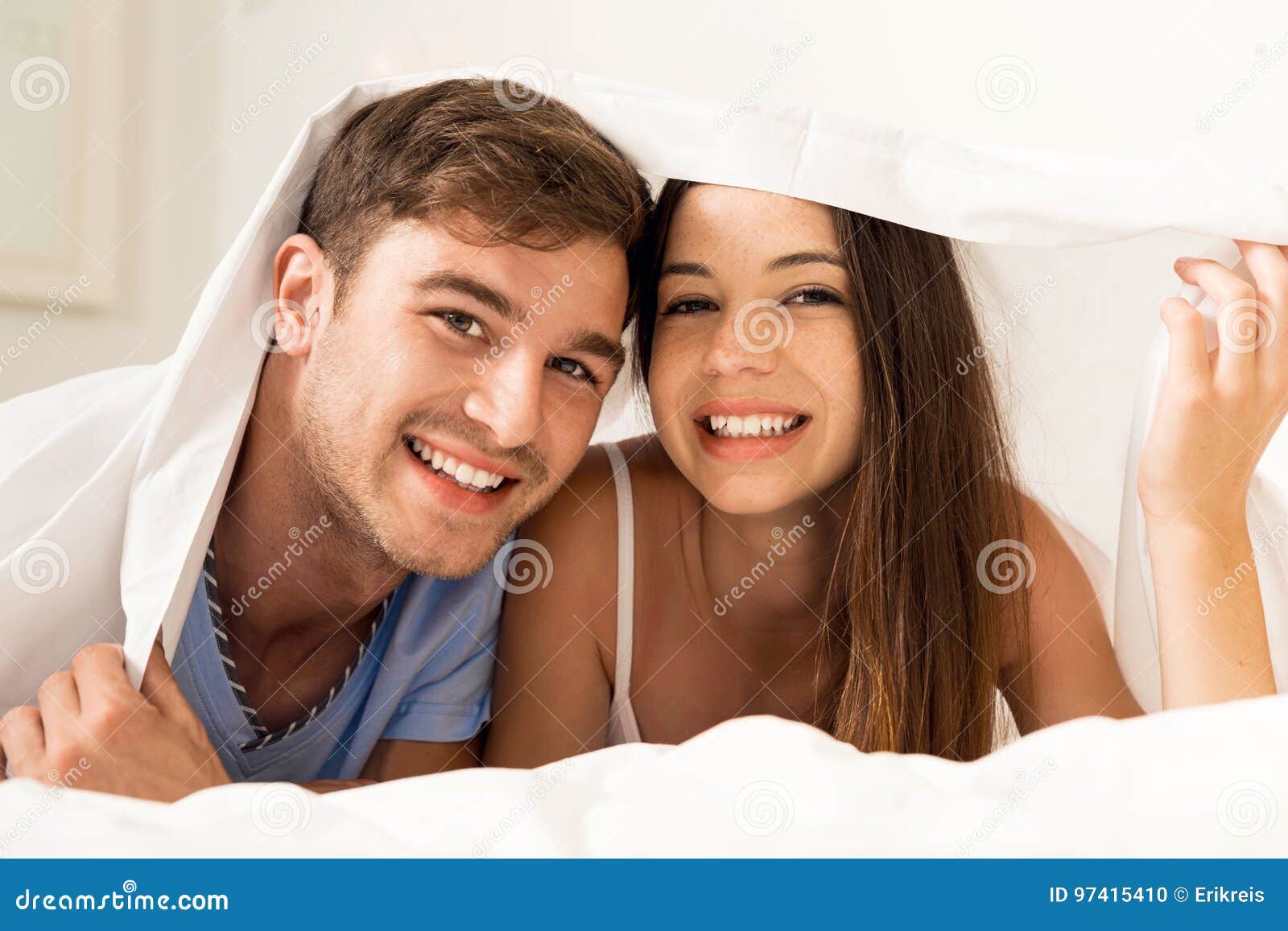 Playing under the sheets stock photo. Image of affection - 97415410