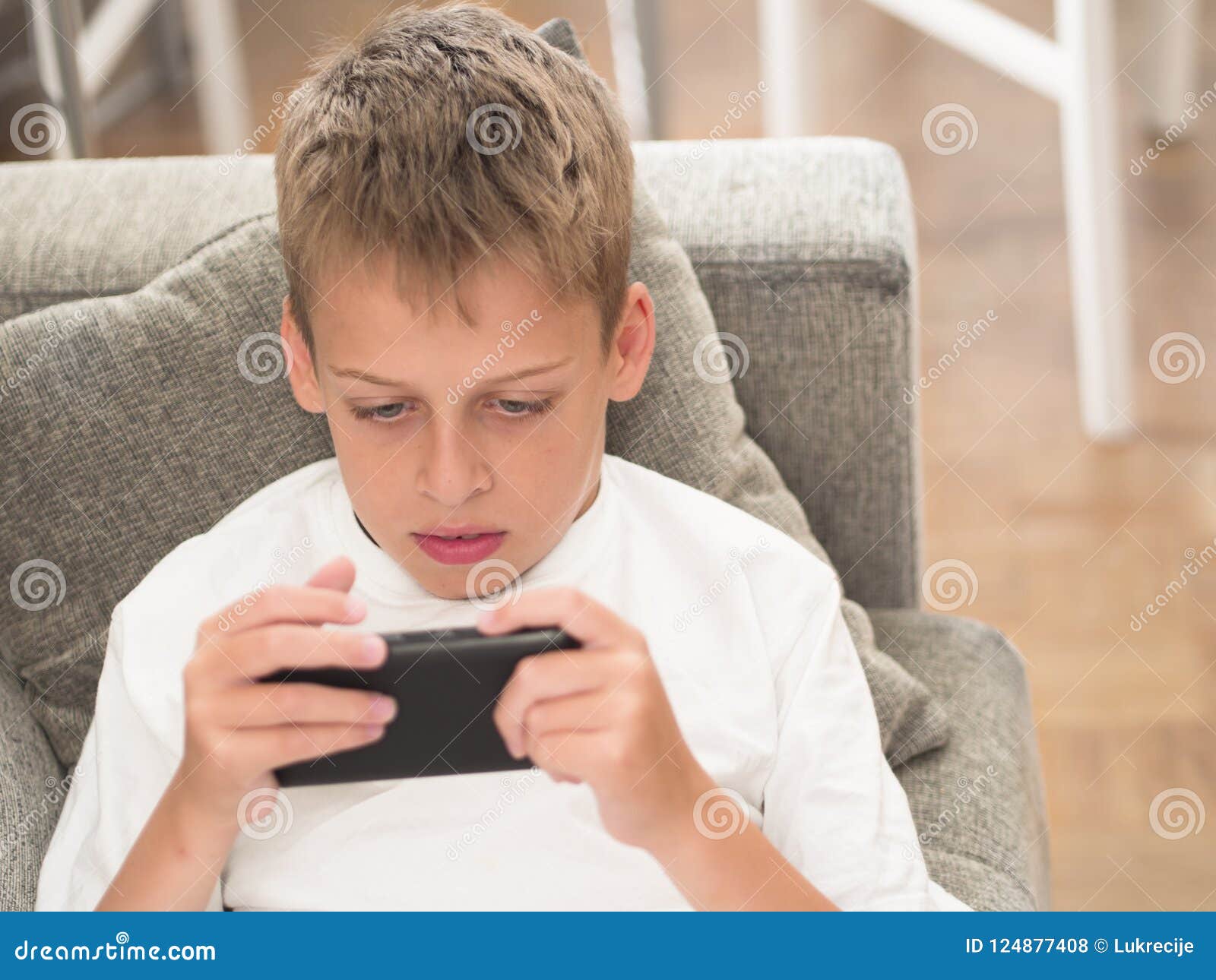 Cute boy with cell phone stock photo. Image of smart - 124877408