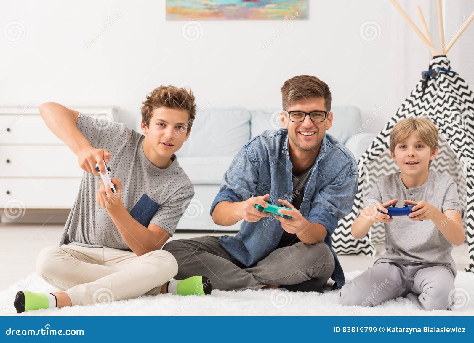 Playing video games stock image. Image of focused, together - 83819799