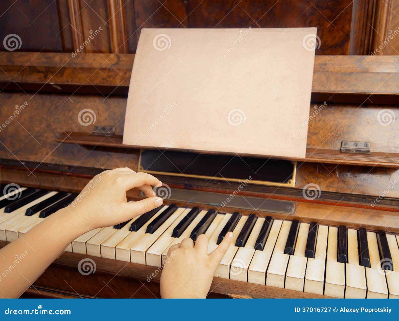 Playing on vintage piano stock image. Image of instrument - 37016727