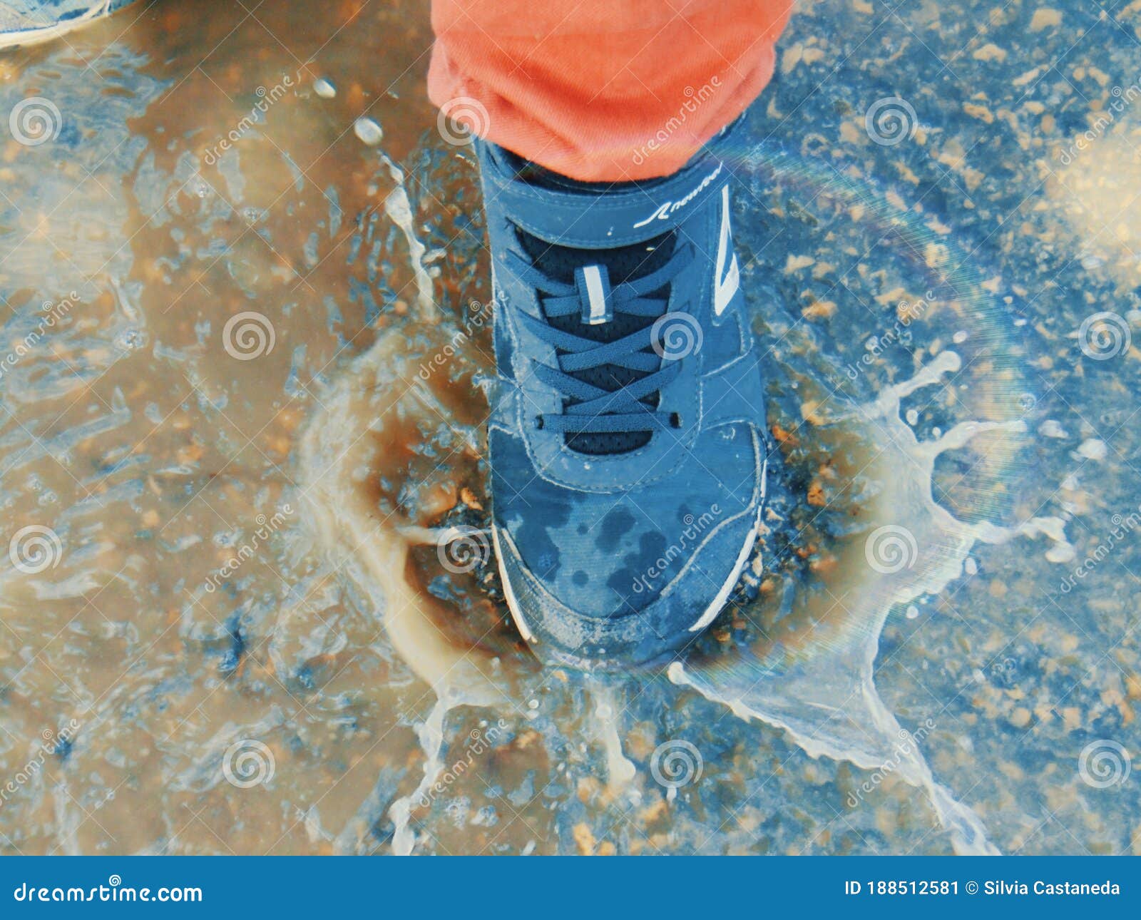 Playing in the puddles stock image. Image of water, puddles - 188512581