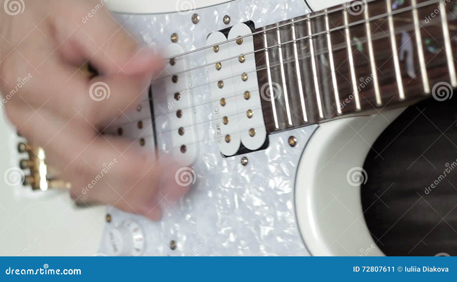 Playing White Electric Guitar with His Right Hand Stock Video - Video ...