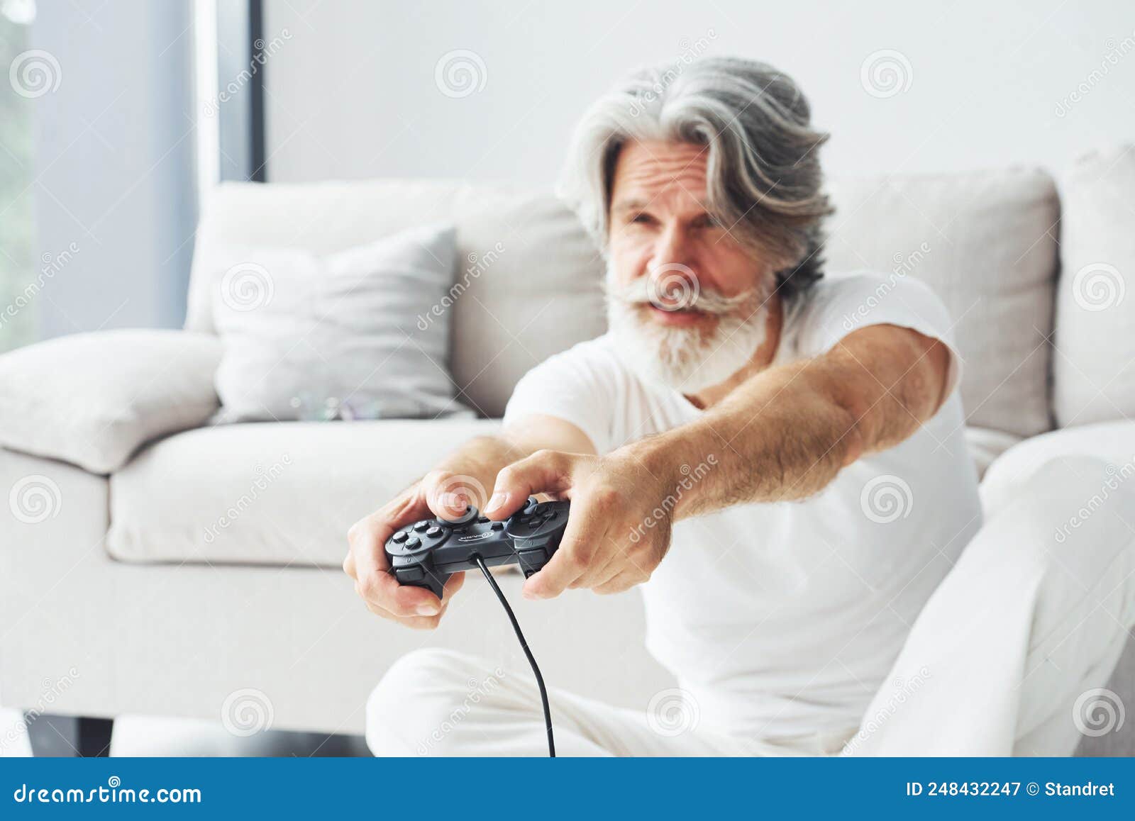 Plays Video Game by Using Controller. Senior Stylish Modern Man with ...
