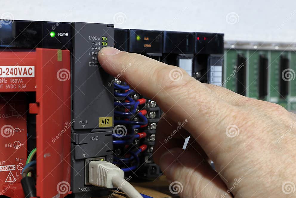 PLC - Programmable Logic Controller. Production Automation. the Hand ...