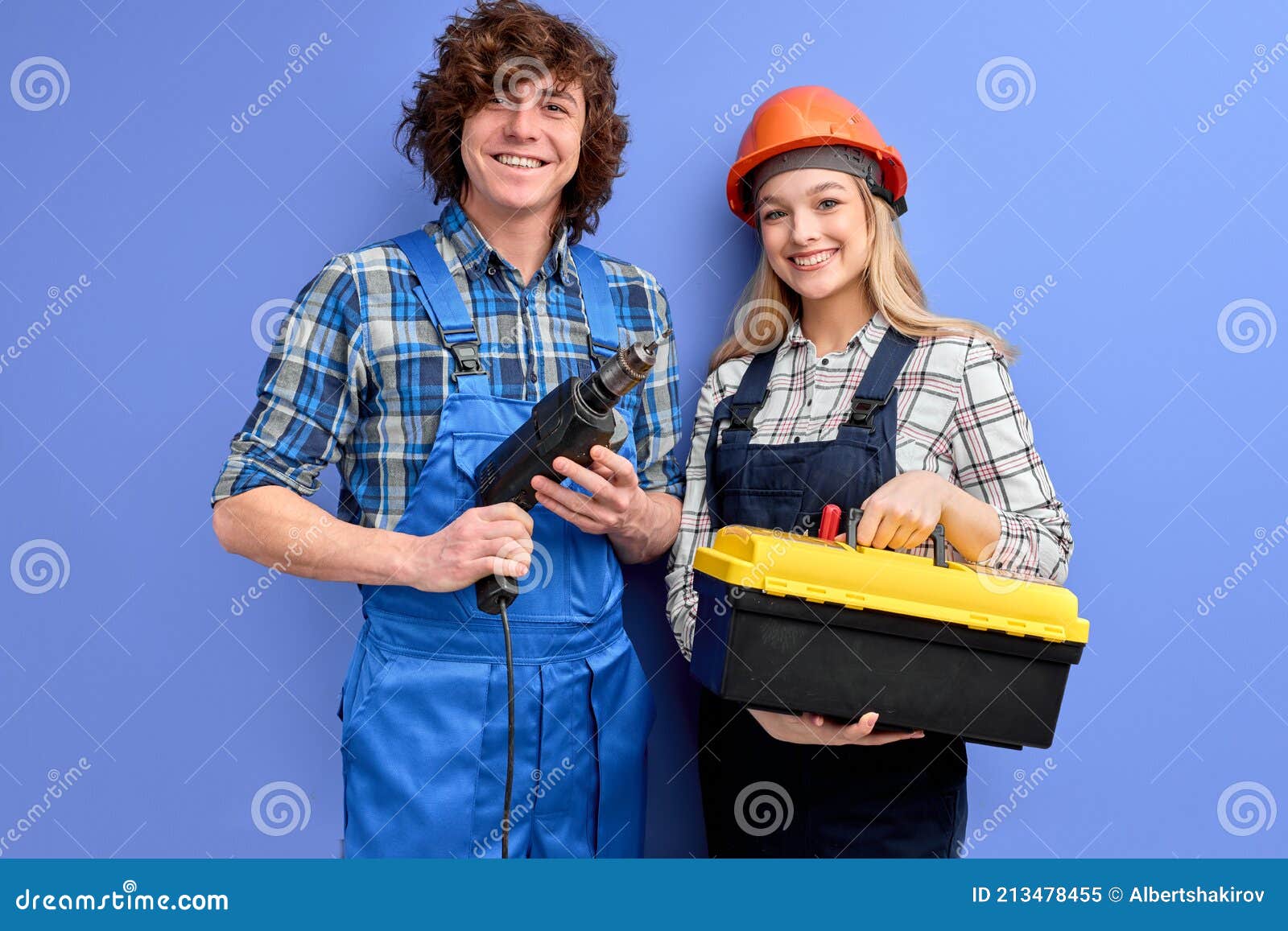 Pleasant Architects in Uniform Coveralls Stand with Tools Instruments ...