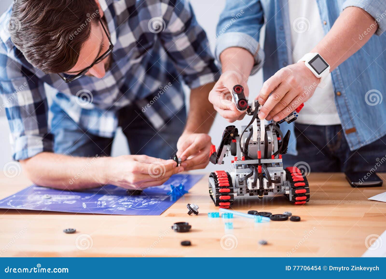 Pleasant Colleagues Constructing Robot Stock Photo - Image of tech ...