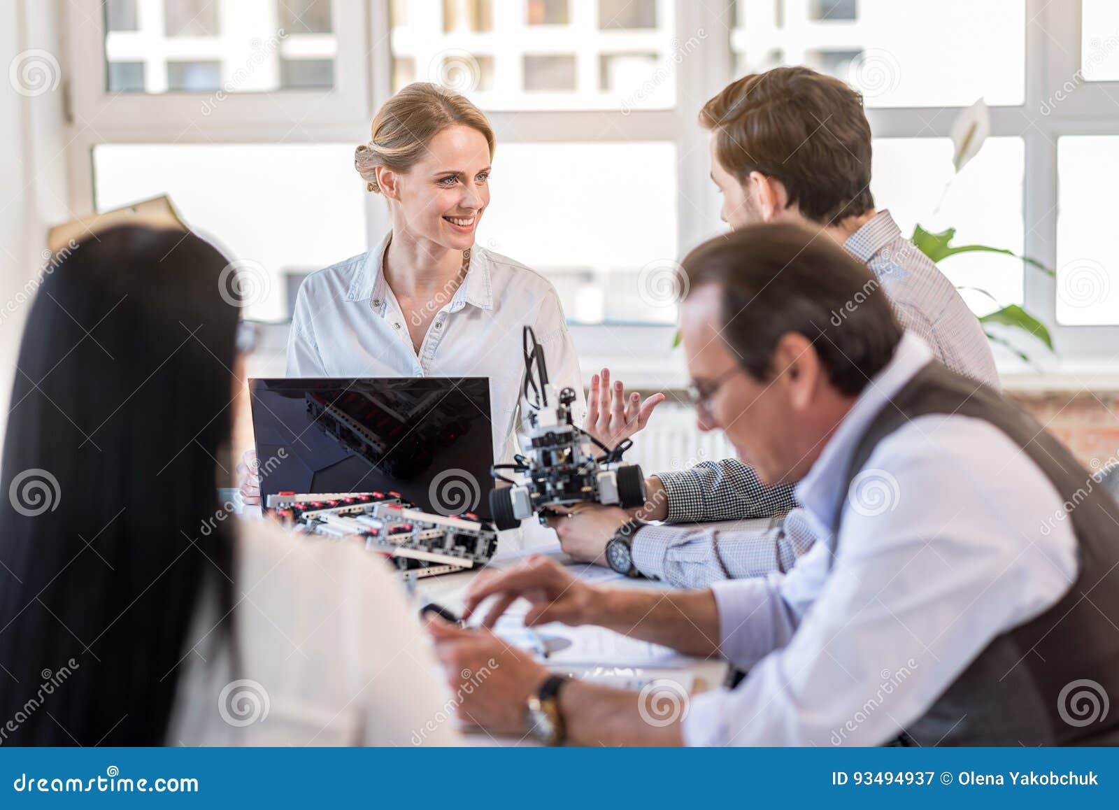 Pleasant Engineers Sitting Around Table Stock Image - Image of ...