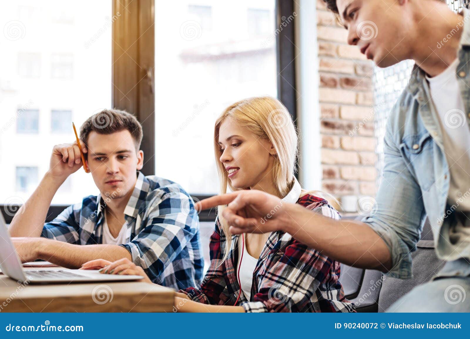 Pleasant Involved Students Discussing Project Stock Photo - Image of ...