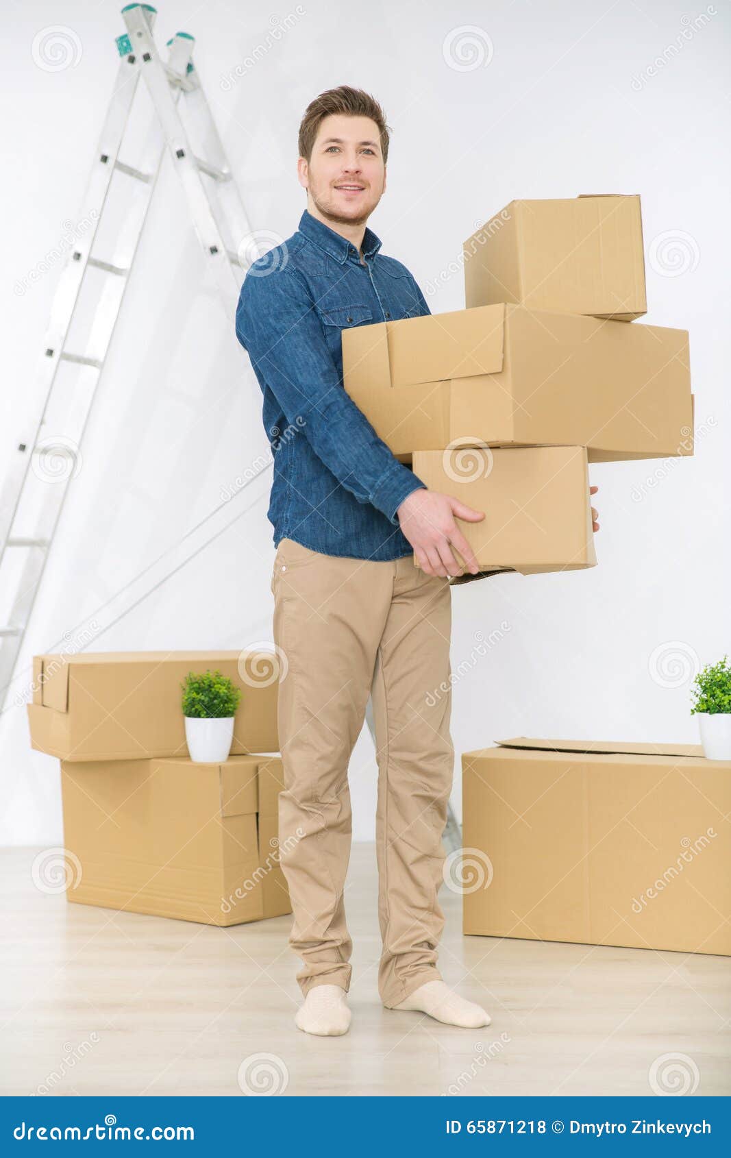 Pleasant man holding boxes stock photo. Image of house - 65871218