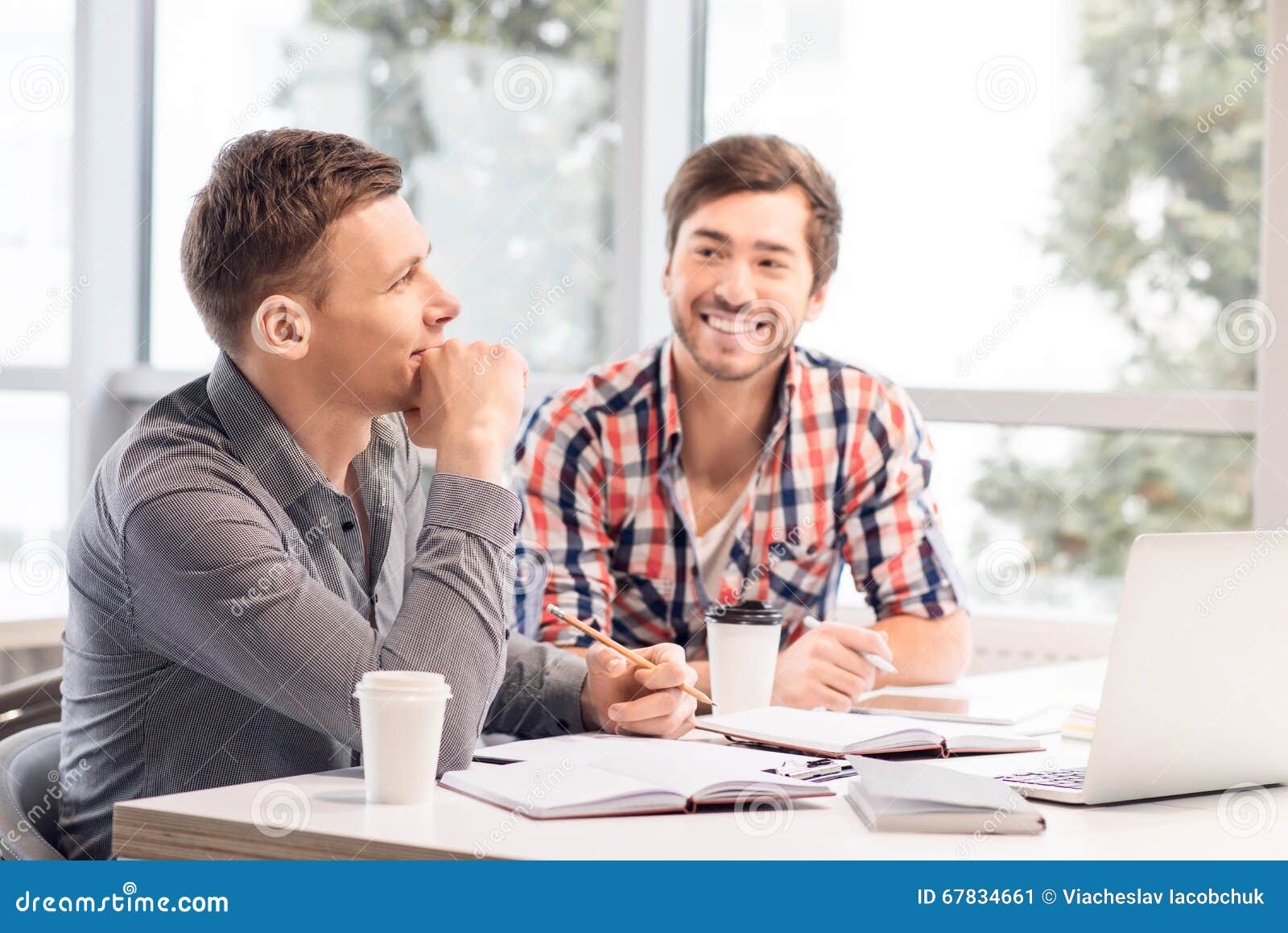 Pleasant Men Sitting at the Table Stock Image - Image of positive ...
