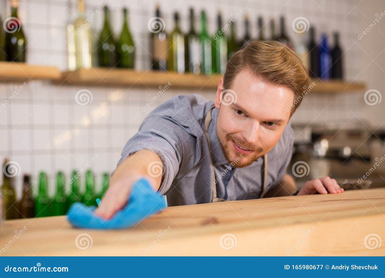 Pleasant Nice Man Cleaning the Table Stock Image - Image of person ...