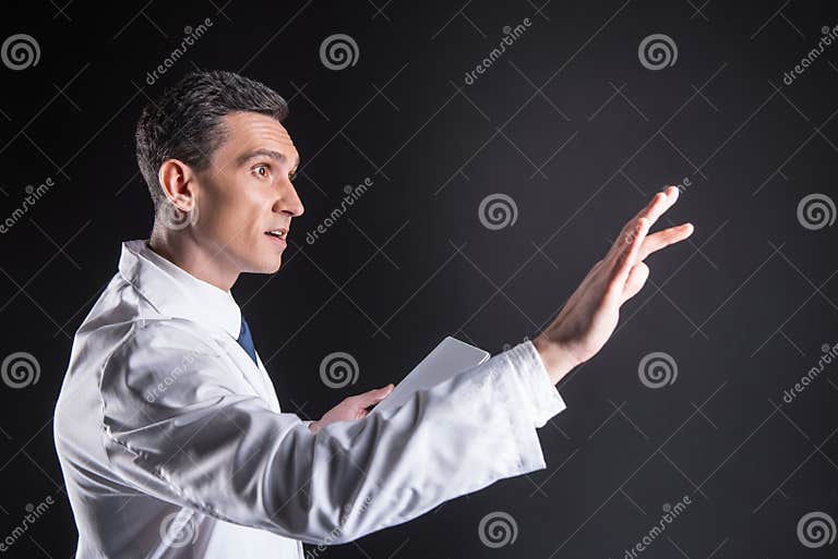 Pleasant Nice Scientist Looking at His Hand Stock Photo - Image of ...