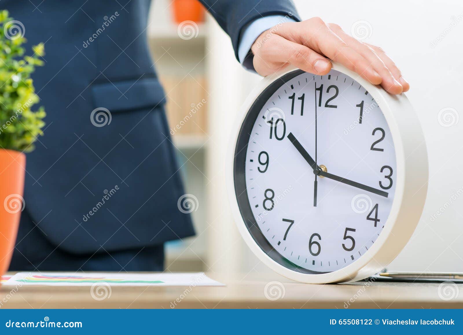 Pleasant Office Worker Holding Clock Stock Photo - Image of money ...