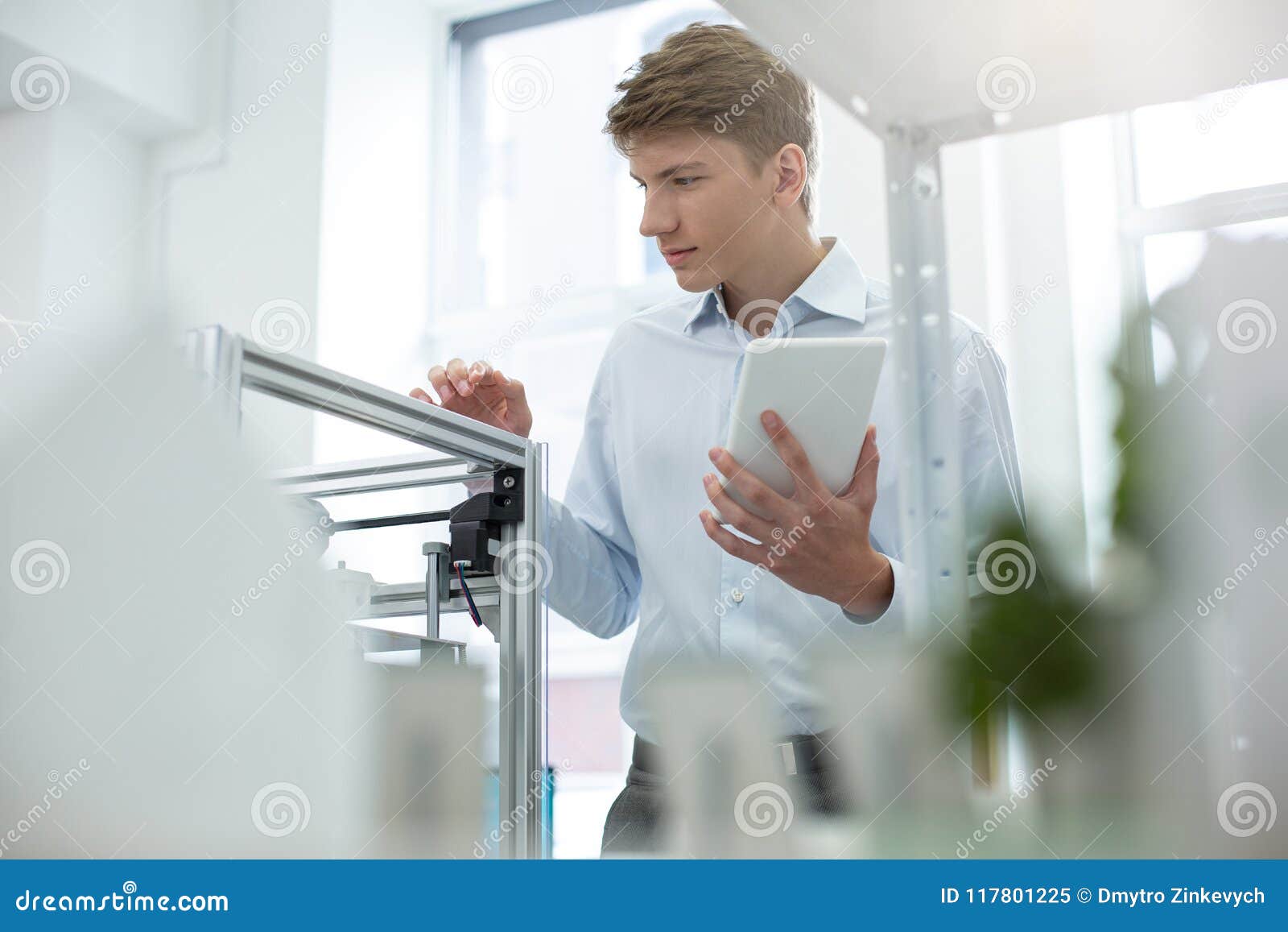 Pleasant Office Worker Holding Tablet and Observing Printing Stock ...