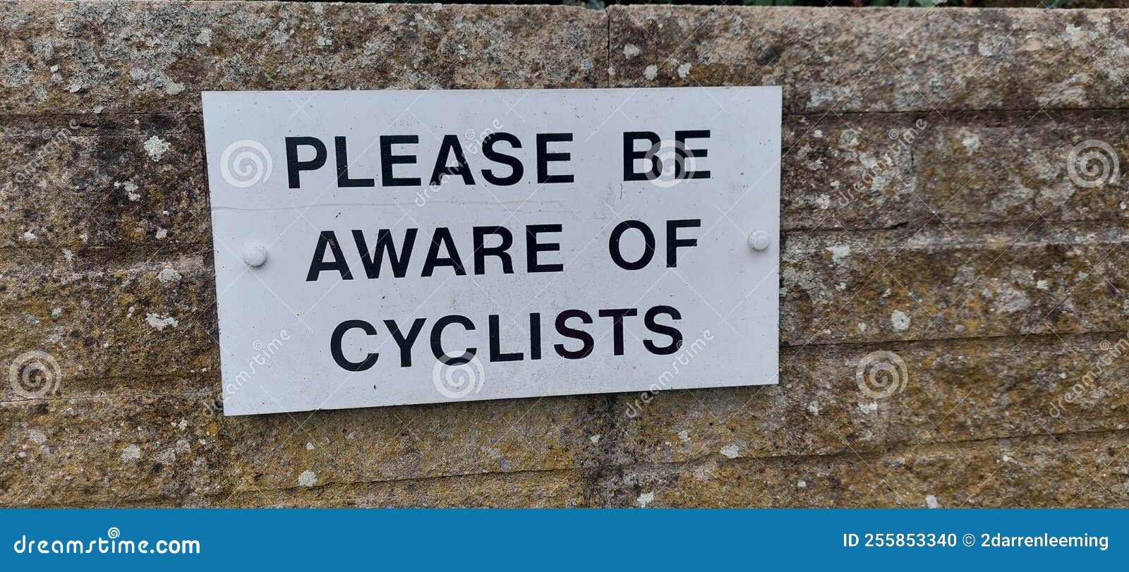 Please Be Aware of Cyclists Sign Black and White on the Stone Wall ...