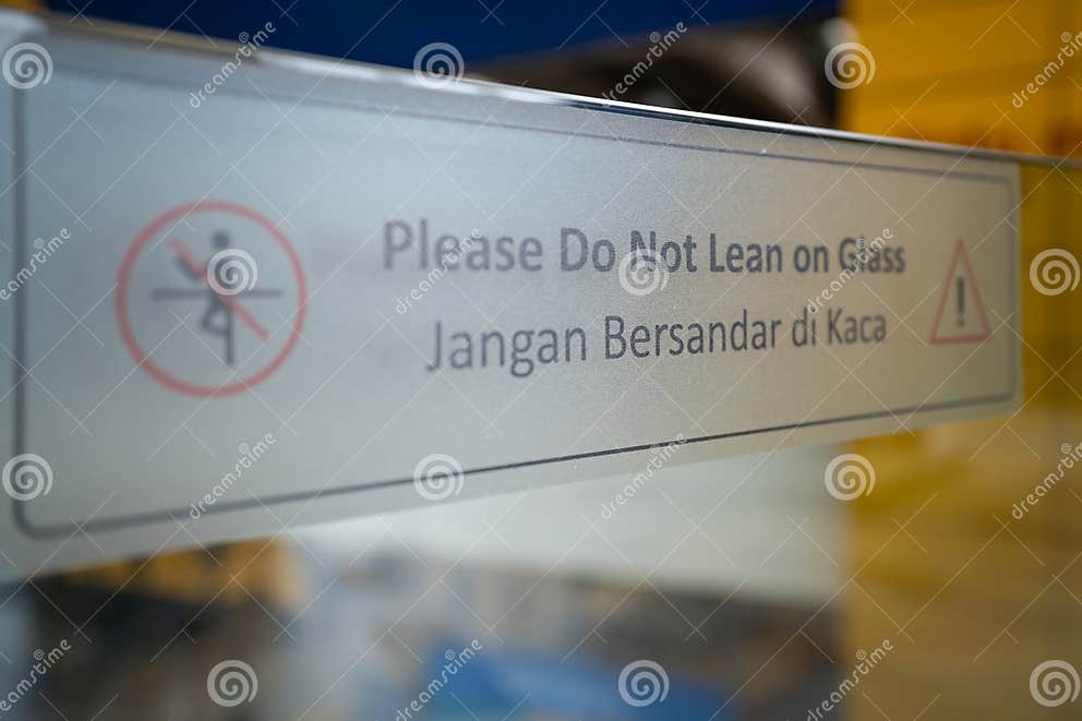 "Please Do Not Lean on Glass" Sticker on the Glass Railing Stock Photo ...