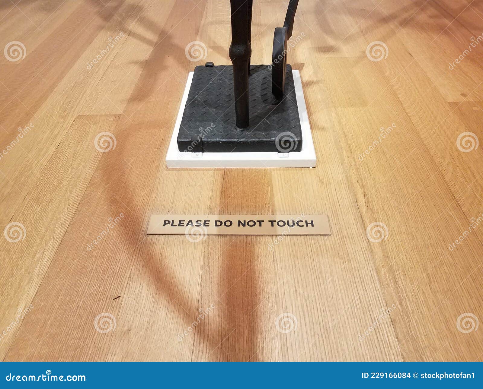 Please Do Not Touch Sign on Floor Near Sculpture Stock Photo - Image of ...