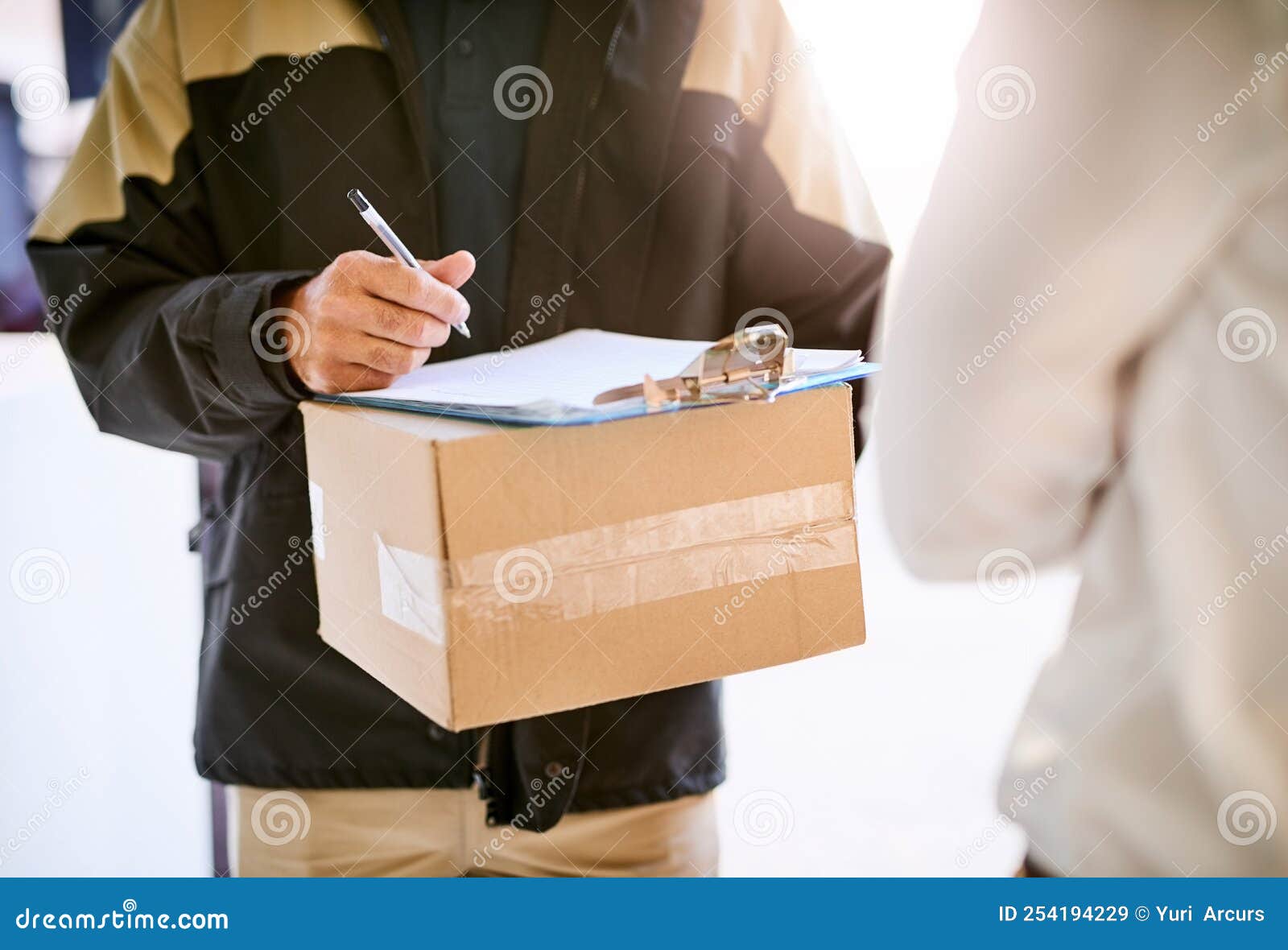 Please Sign Here. a Courier Making a Delivery To a Customer. Stock ...