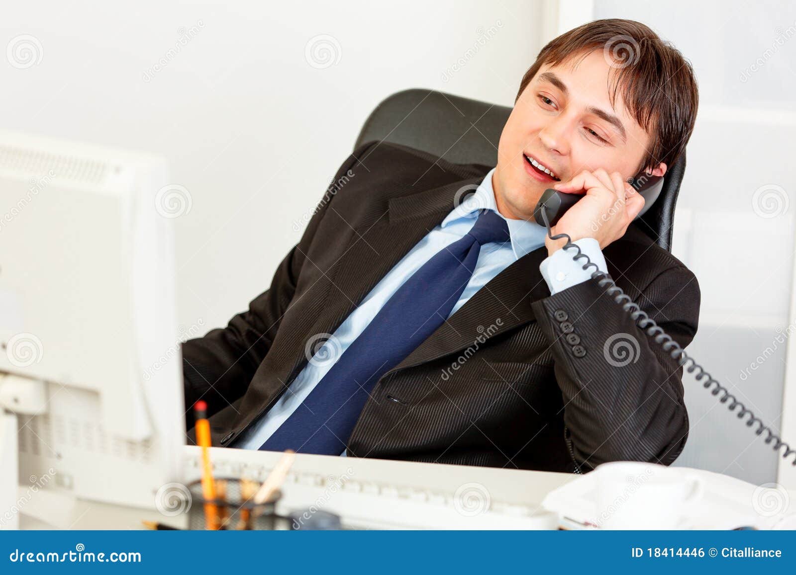 Pleased Businessman in Office Talking on Phone Stock Photo - Image of ...