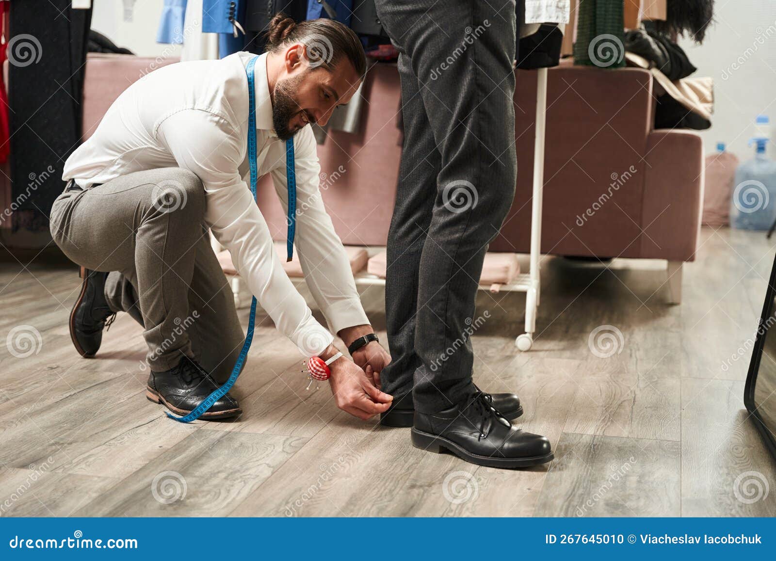 Pleased Clothier Conducting Fitting Session with His Client Stock Photo ...