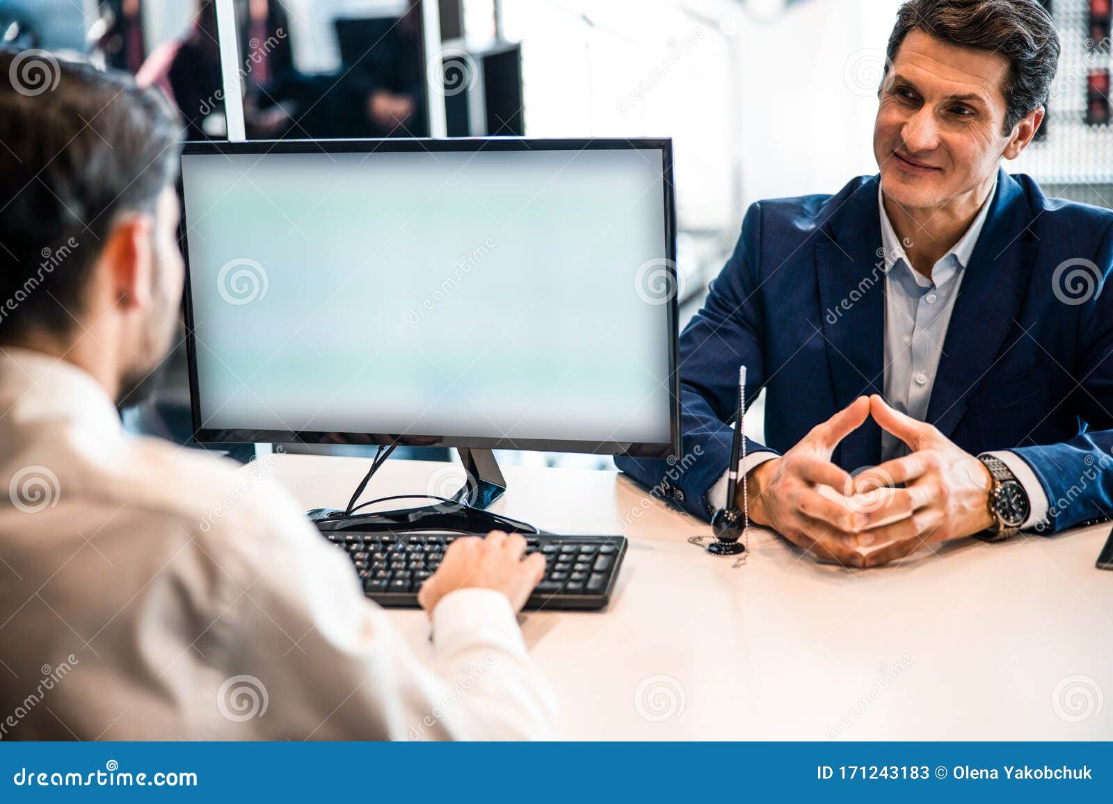 Pleased Customer Sitting in Front of a Manager Stock Image - Image of ...