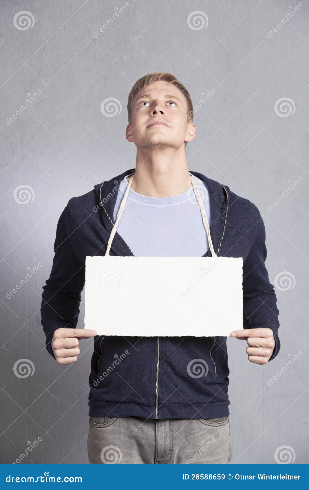 Pleased Likable Man Holding Empty Signboard. Stock Image - Image of ...