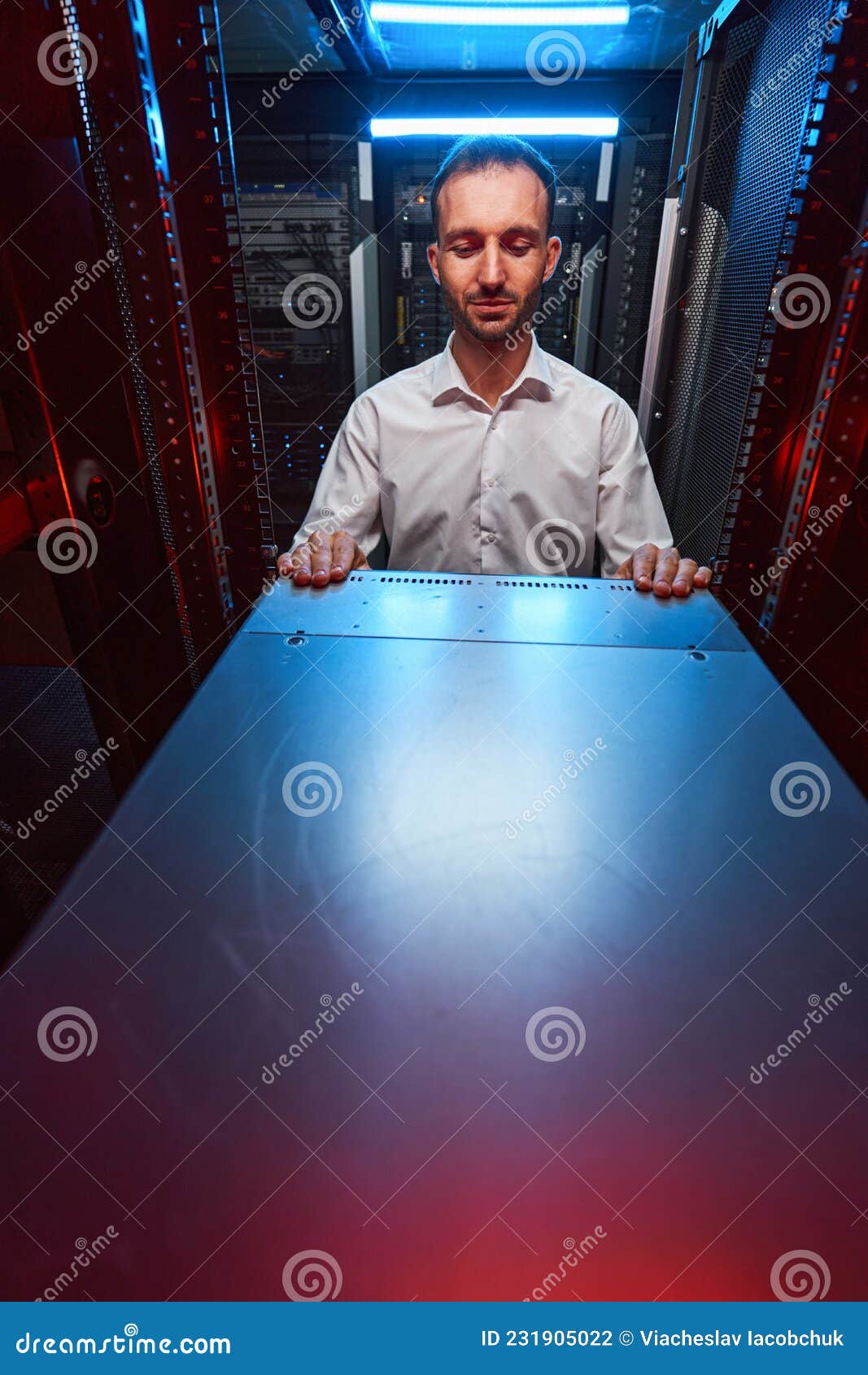 Pleased Network Administrator Looking at Server Cabinet Stock Photo ...