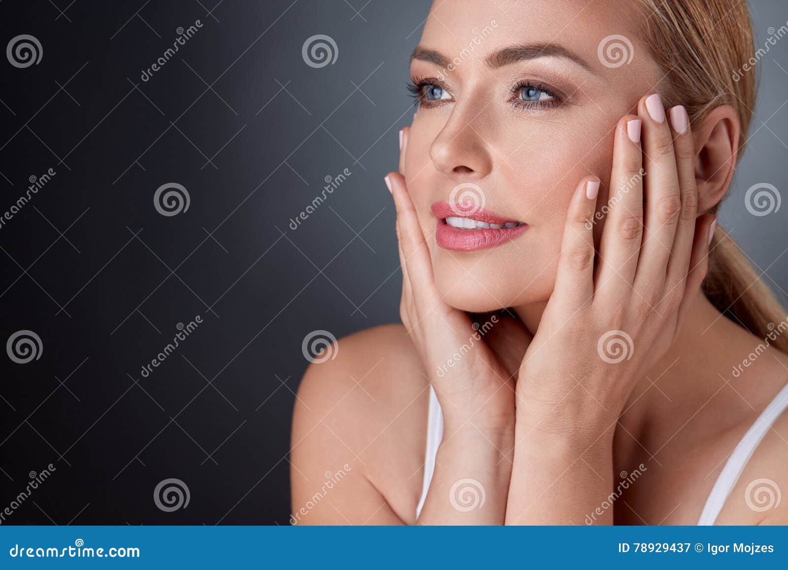 Pleased Woman Touching Face Stock Image - Image of happy, female: 78929437