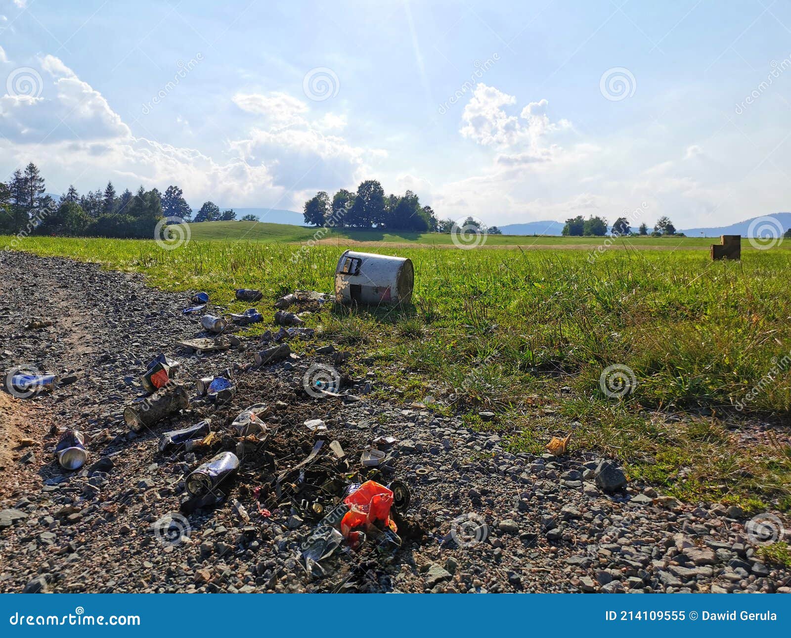 Plenty of Trash Thrown Away in the Natural Green Fields, with Mountains ...
