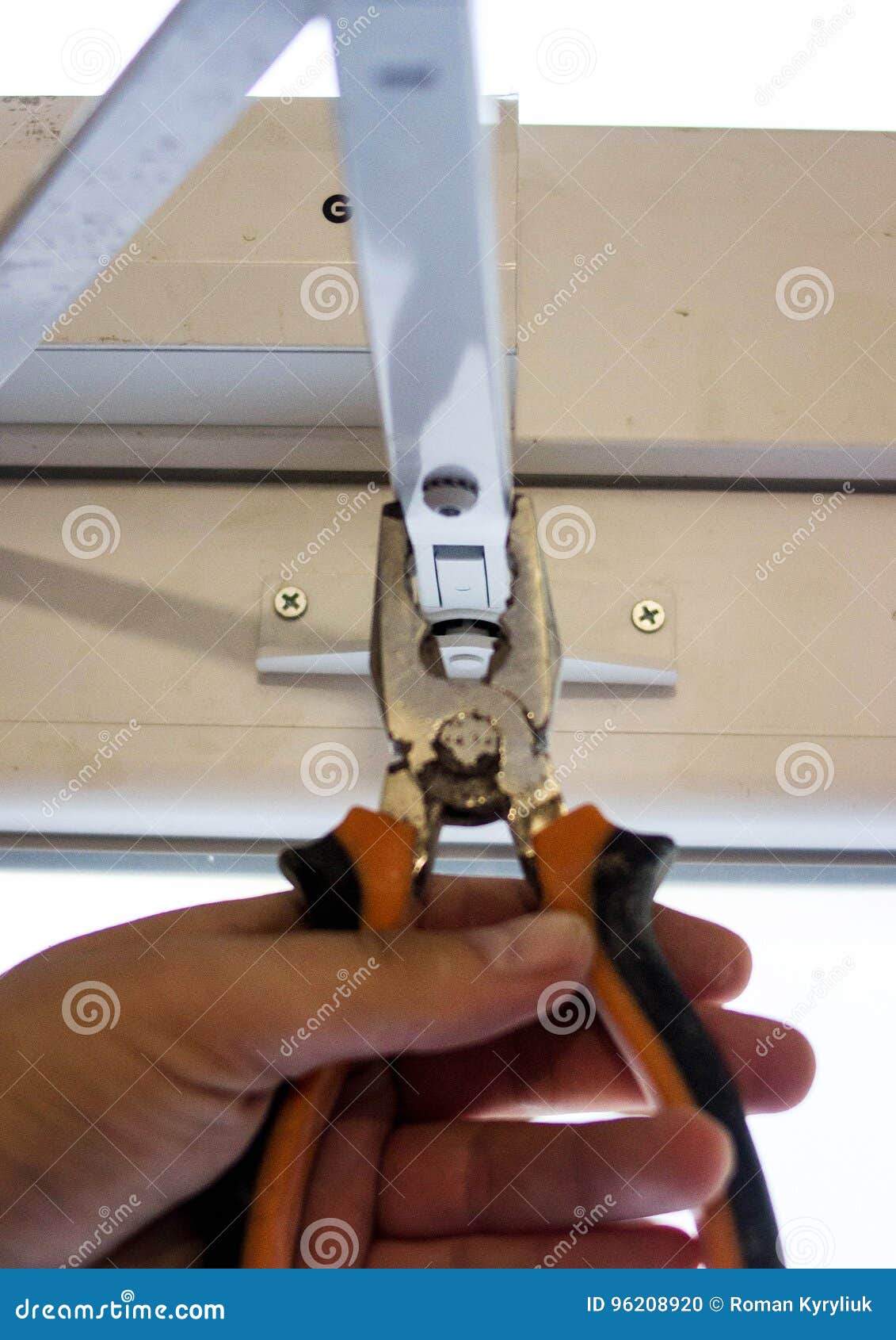 Pliers in the hand stock photo. Image of object, holding - 96208920