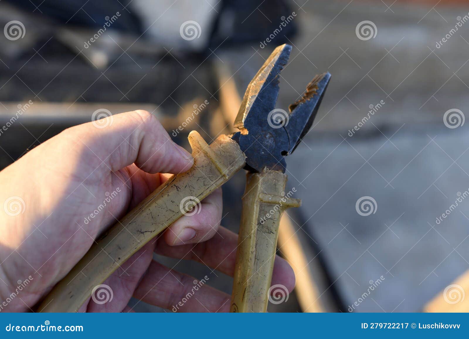 Pliers in the Hands of a Master. Pliers with a Plastic Handle Stock ...