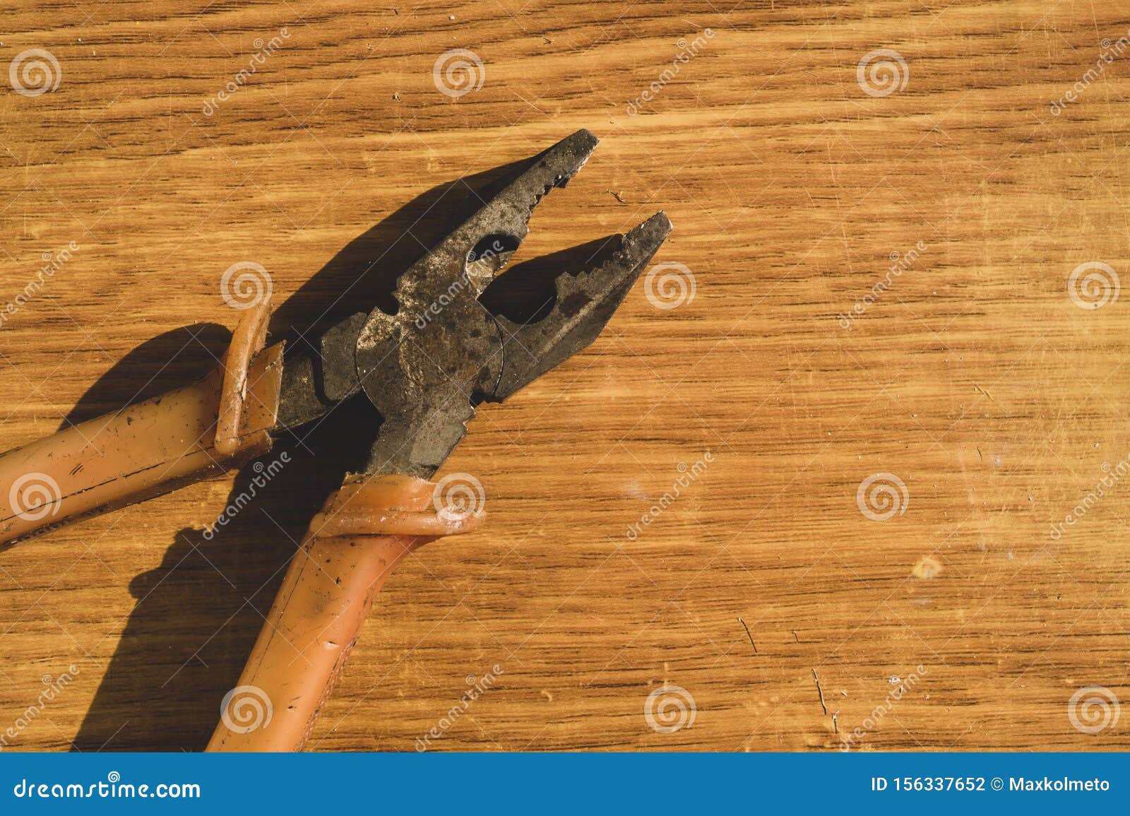 Pliers with Orange Handles on Wooden Background. Working Tool Stock ...