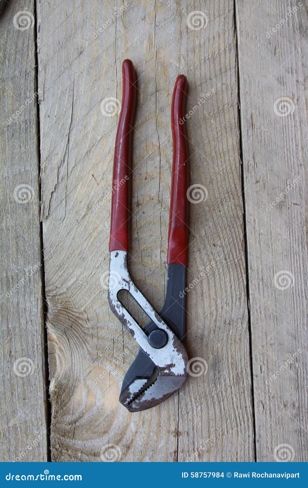 Pliers on wooden table stock photo. Image of work, manual - 58757984