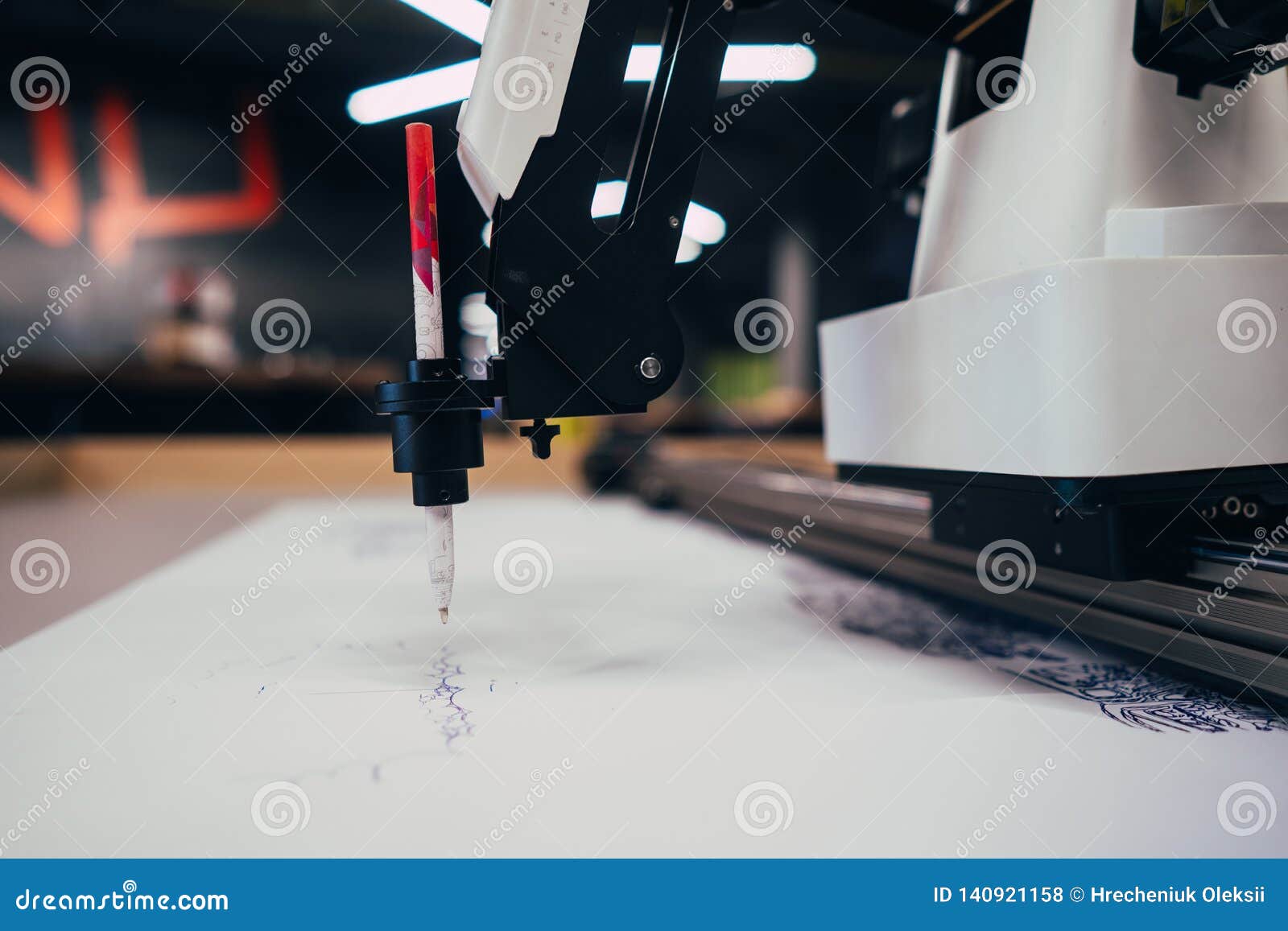 Plotter Draws a Pen Drawing on a Sheet of White Paper Stock Photo ...