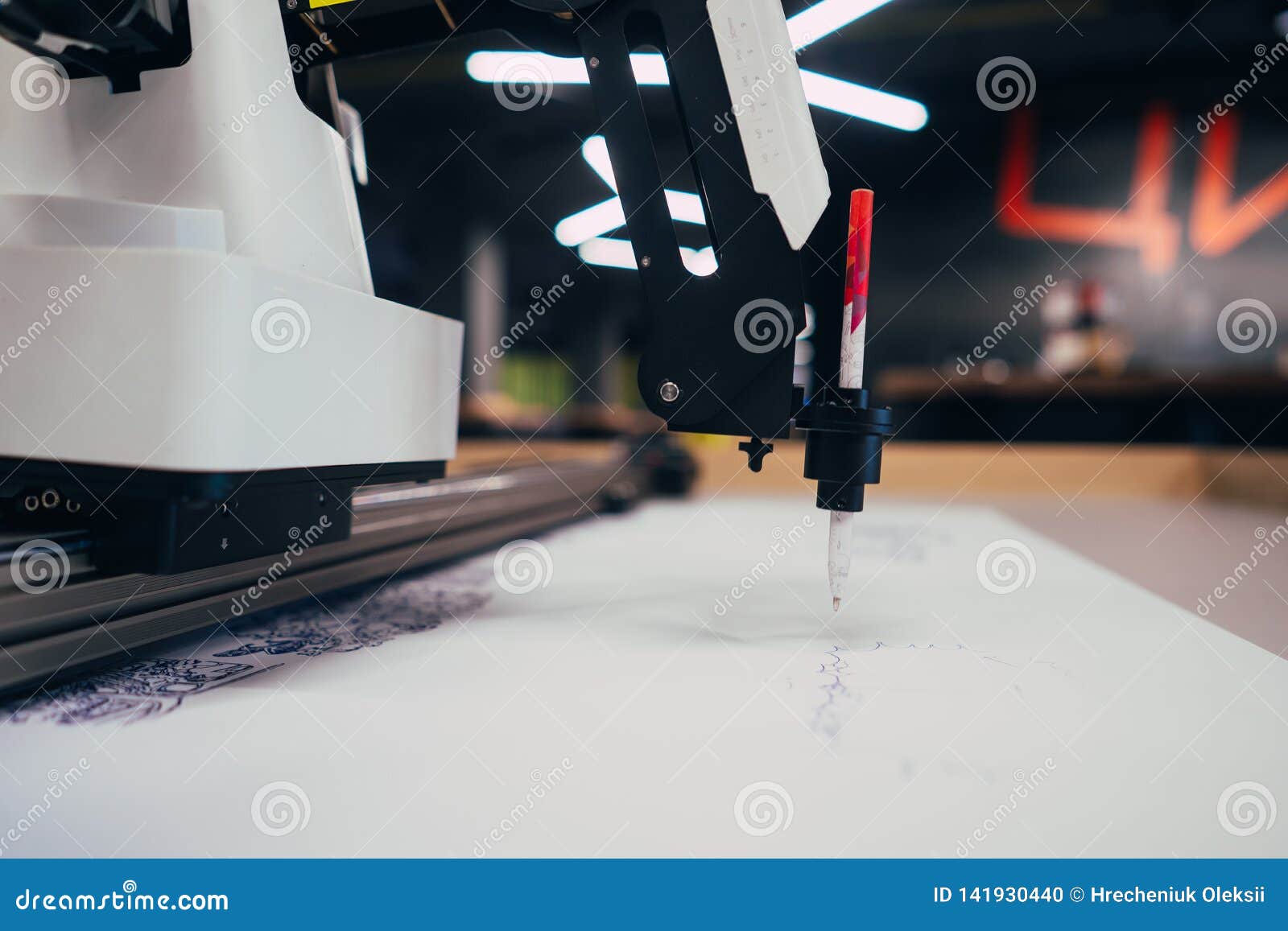 Plotter Draws a Pen Drawing on a Sheet of White Paper Stock Photo ...