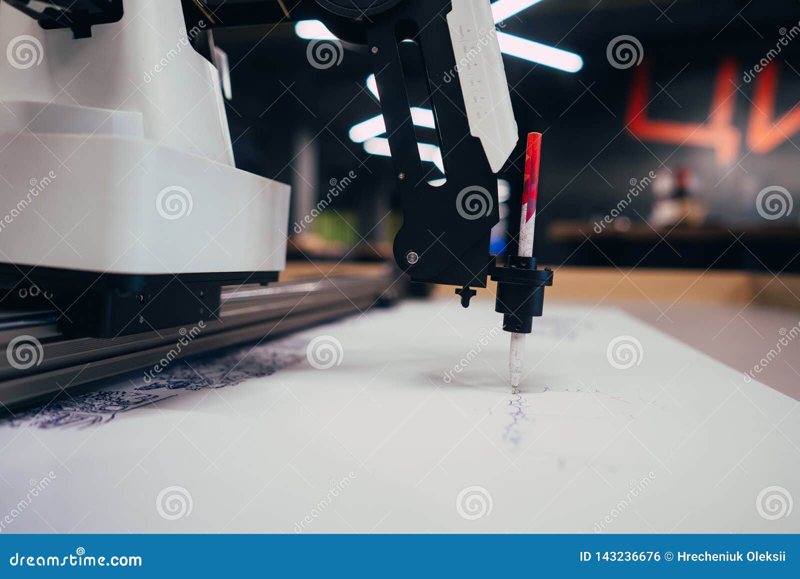 Plotter Draws a Pen Drawing on a Sheet of White Paper Stock Photo ...